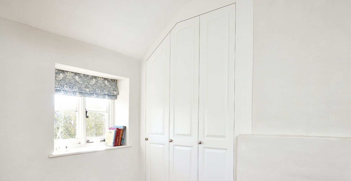 Cosy Cottage Bedroom Enhanced With Fitted Wardrobe